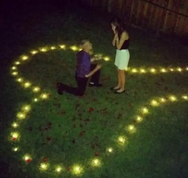 27. Someone from the candles on the ground lays out a heart